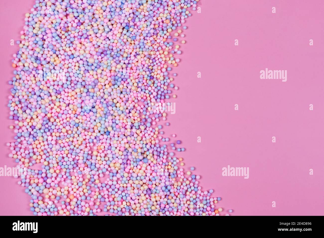 Pile of pastel color balls on pink. Styrofoam or Polystyrene foam ...