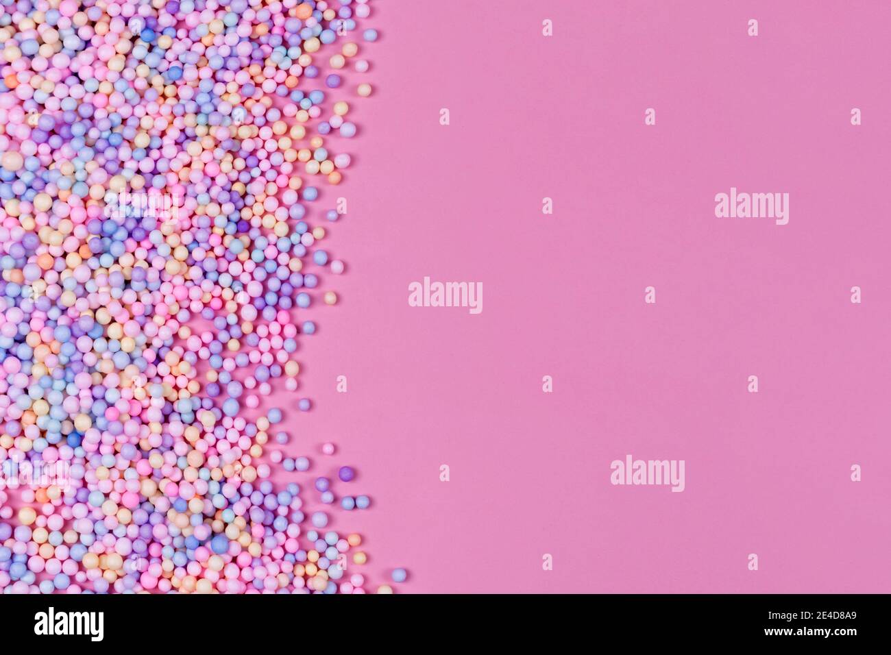 Pile of pastel color balls on pink. Styrofoam or Polystyrene foam ...