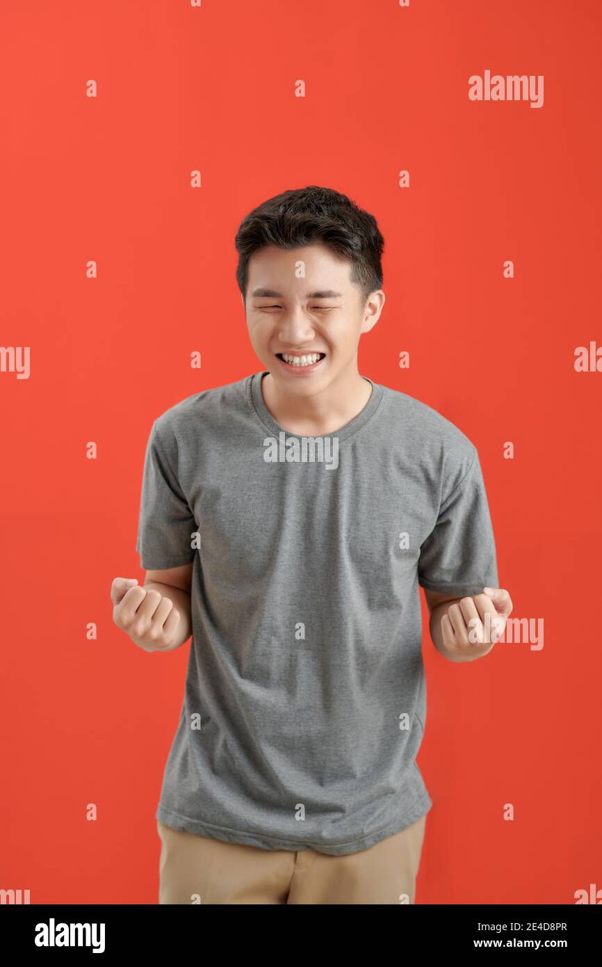 cool asian man winner sign Stock Photo - Alamy