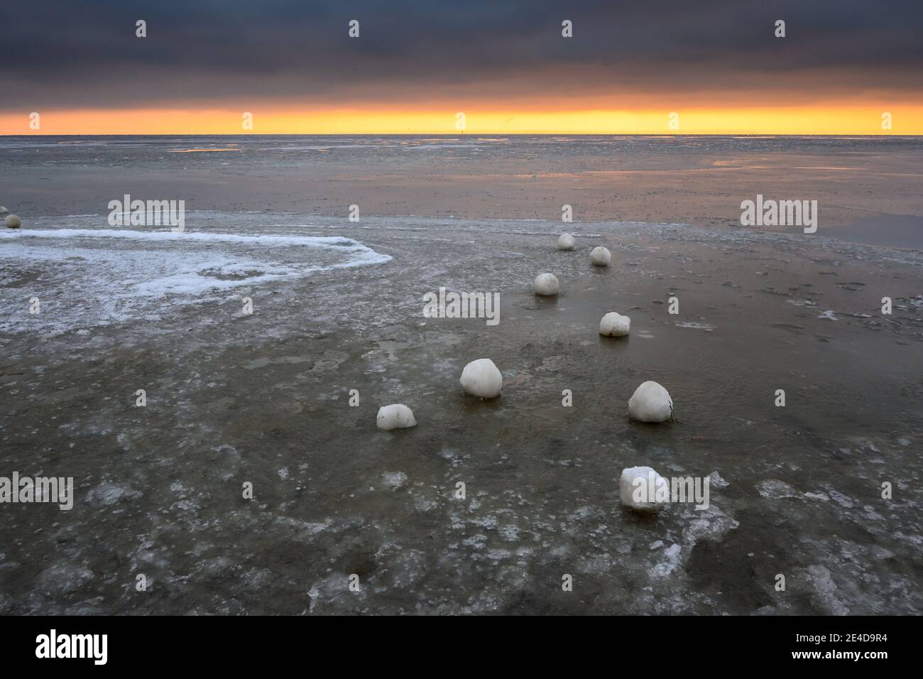 Frozen ice balls on the beach in Jastarnia during winter. Hel Peninsula ...