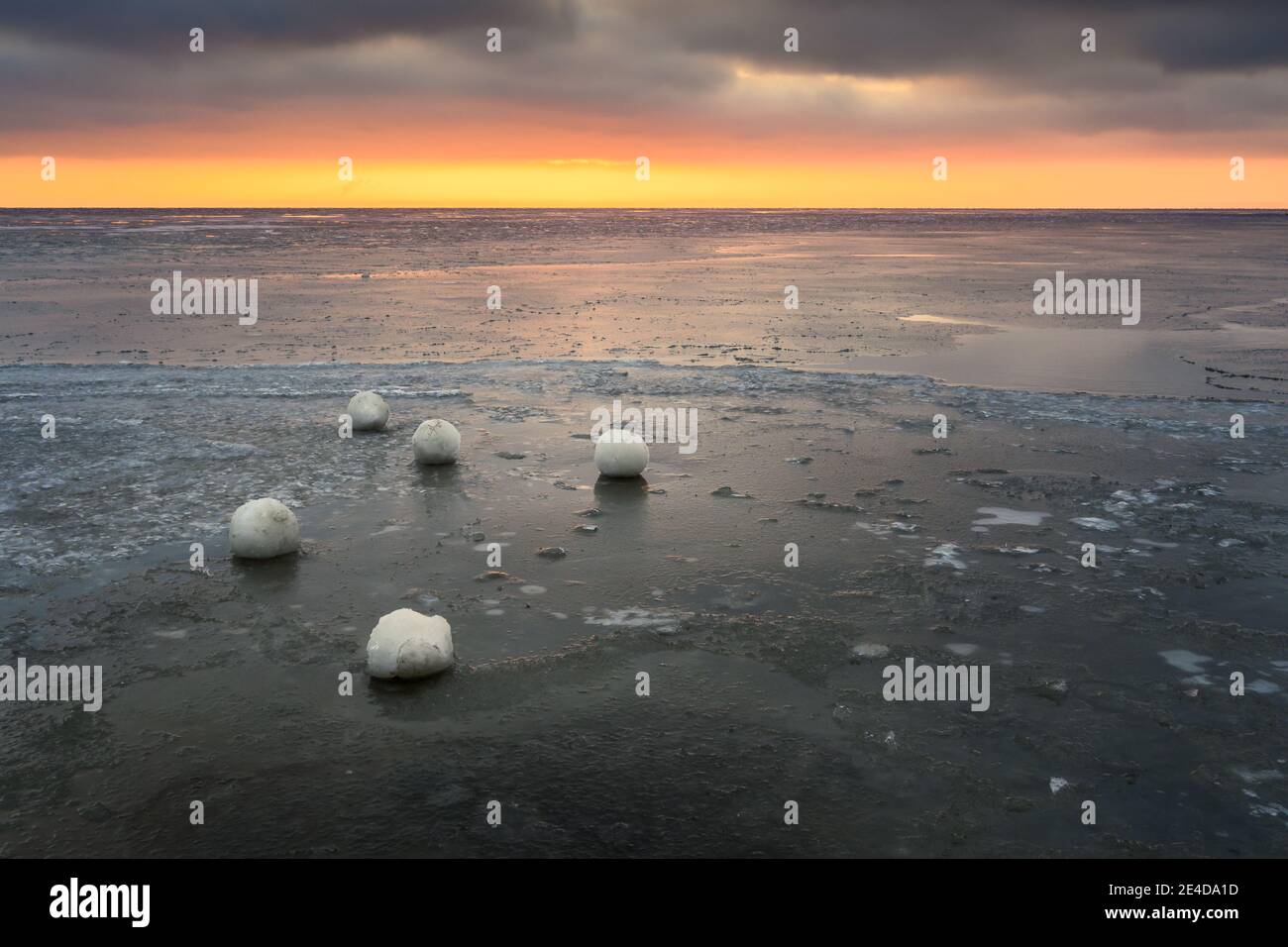 Frozen ice balls on the beach in Jastarnia during winter. Hel Peninsula ...
