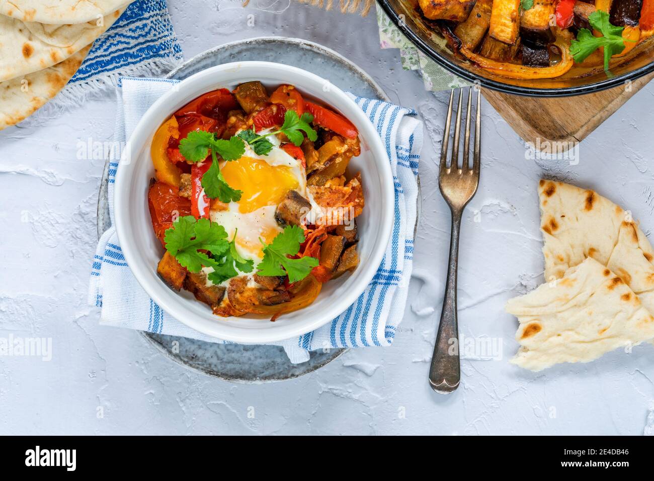 Shakshuka - classic North African and Middle Eastern dish of poached ...