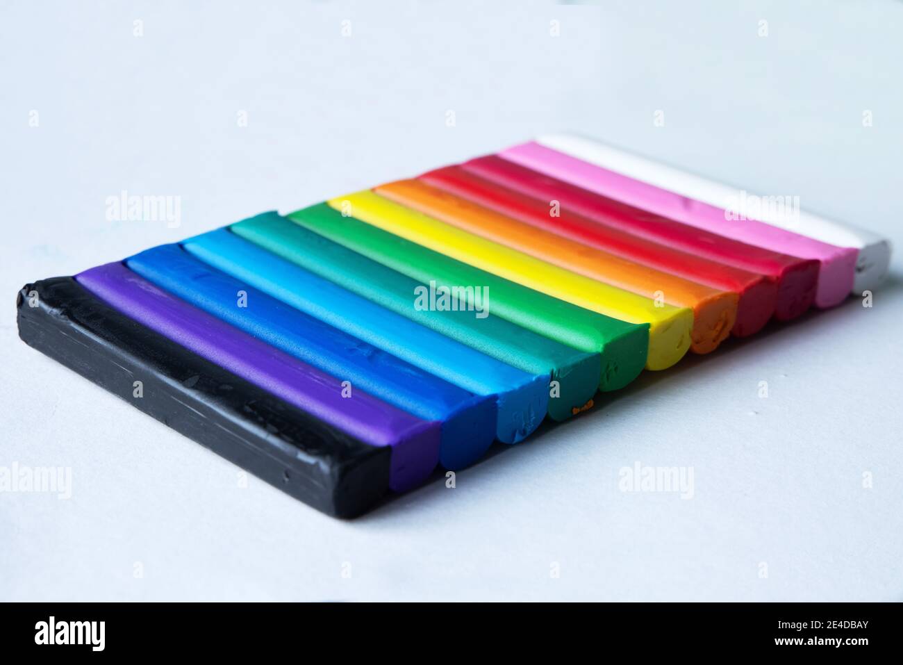 A set of colorful plasticine, modeling clay isolated on white ...