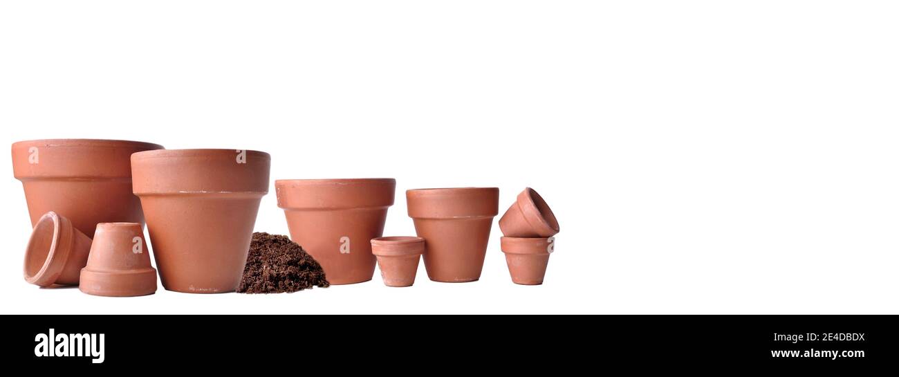 group of terra cotta flower pots empty in panoramic view on white ...
