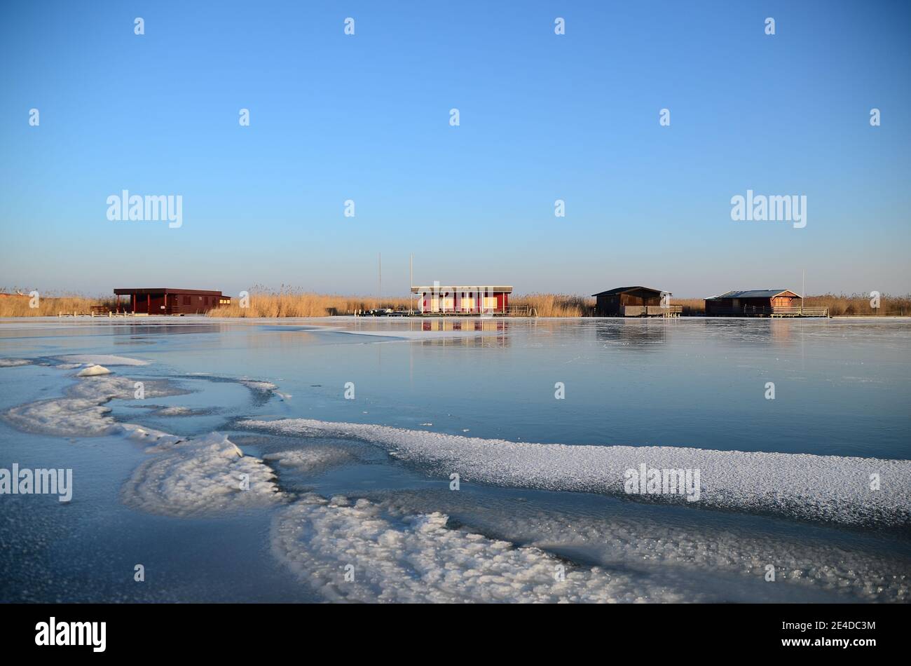 colorful shacks on frozen lake in winter Stock Photo - Alamy
