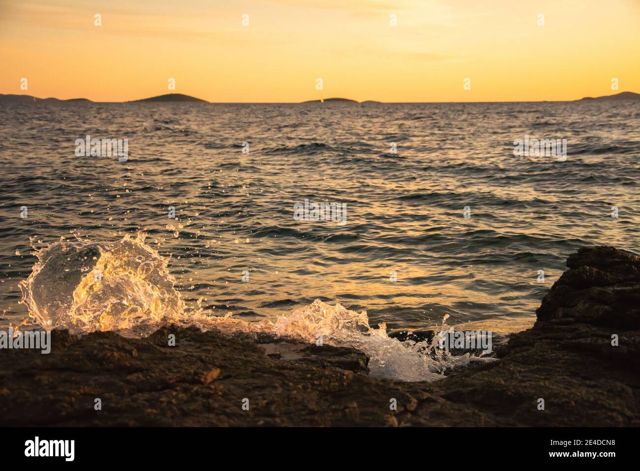 Splashing water caused by waves in the sea Stock Photo - Alamy