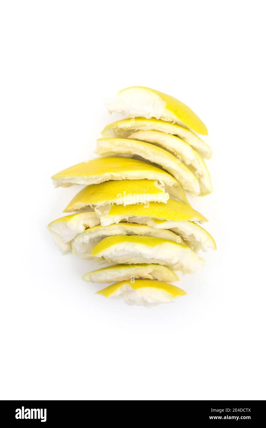 Round pomelo citrus fruit with stack of thick peel at white isolated ...