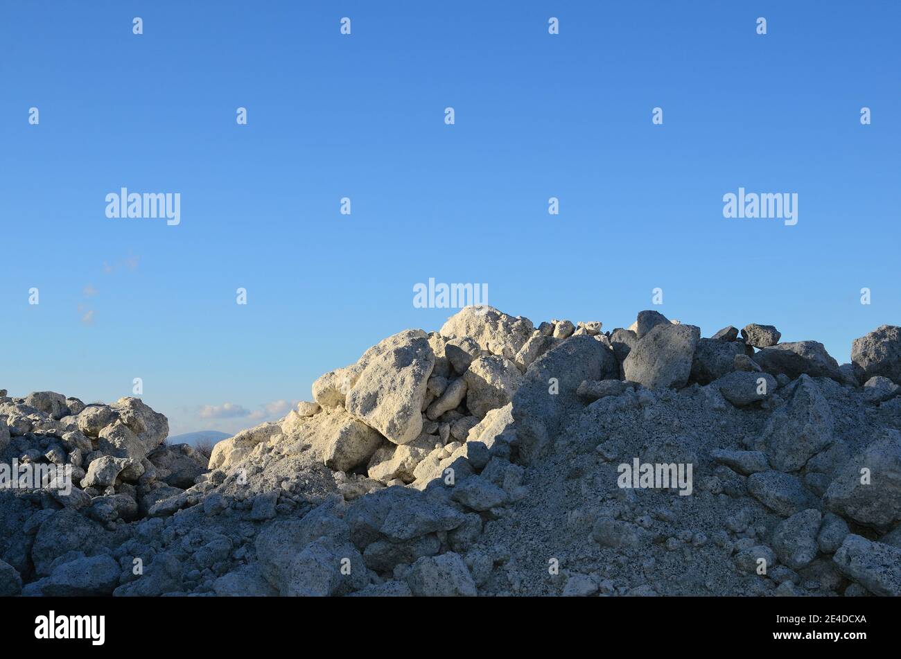 white limestone in the quarry and blue sky Stock Photo - Alamy