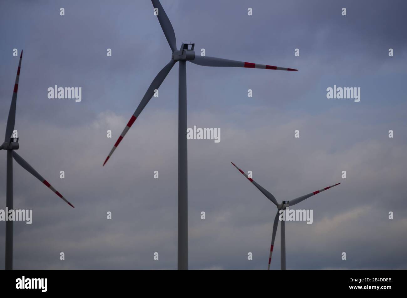 three pinwheels show details with gray sky Stock Photo - Alamy