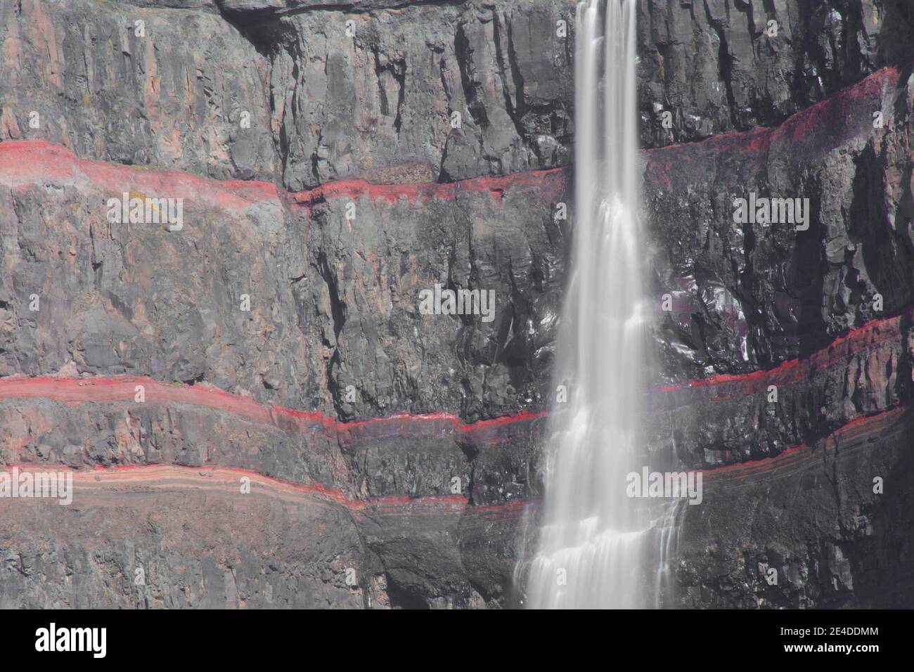 Hengifoss waterfall in iceland with volcanic red clay structure Stock ...