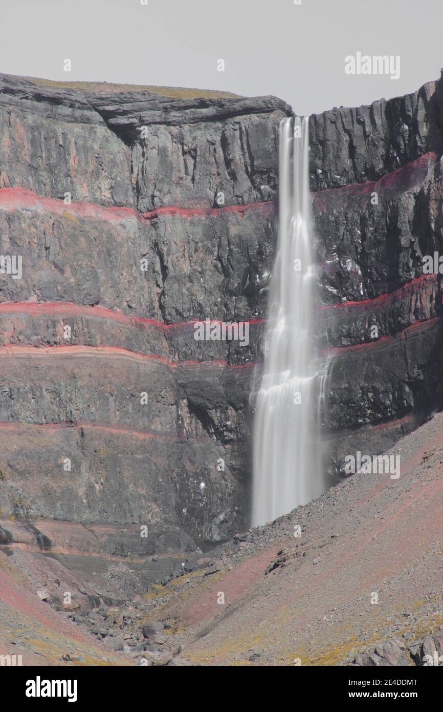 Hengifoss waterfall in iceland with volcanic red clay structure Stock ...