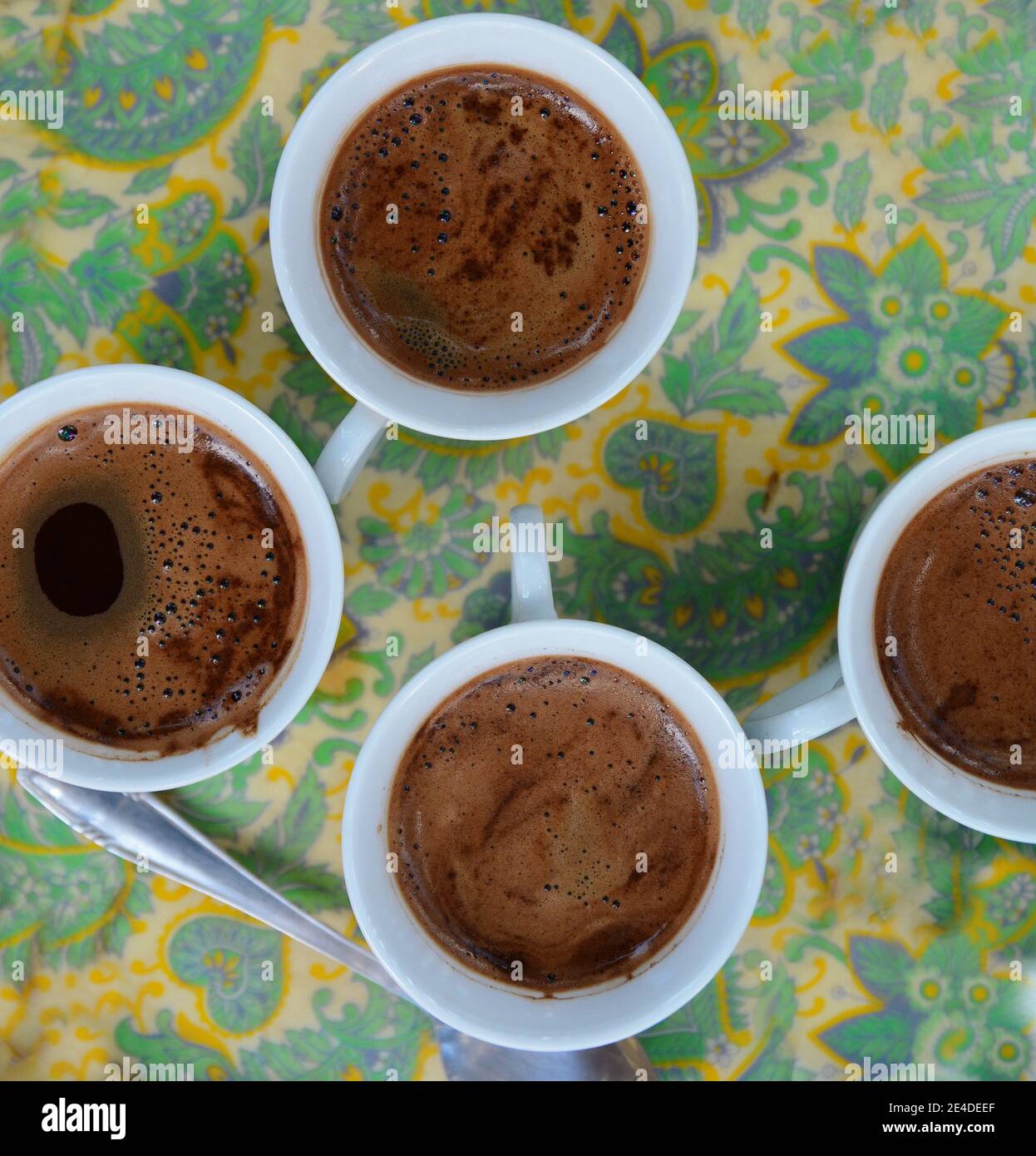 A few cups of coffee on a colorful tray Stock Photo - Alamy