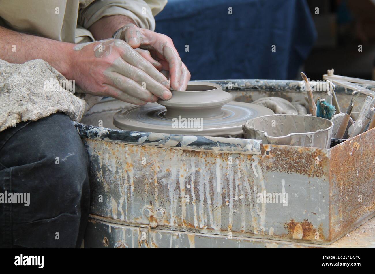 A Potter Turning a Clay Pot Lid on a Traditional Wheel Stock Photo - Alamy