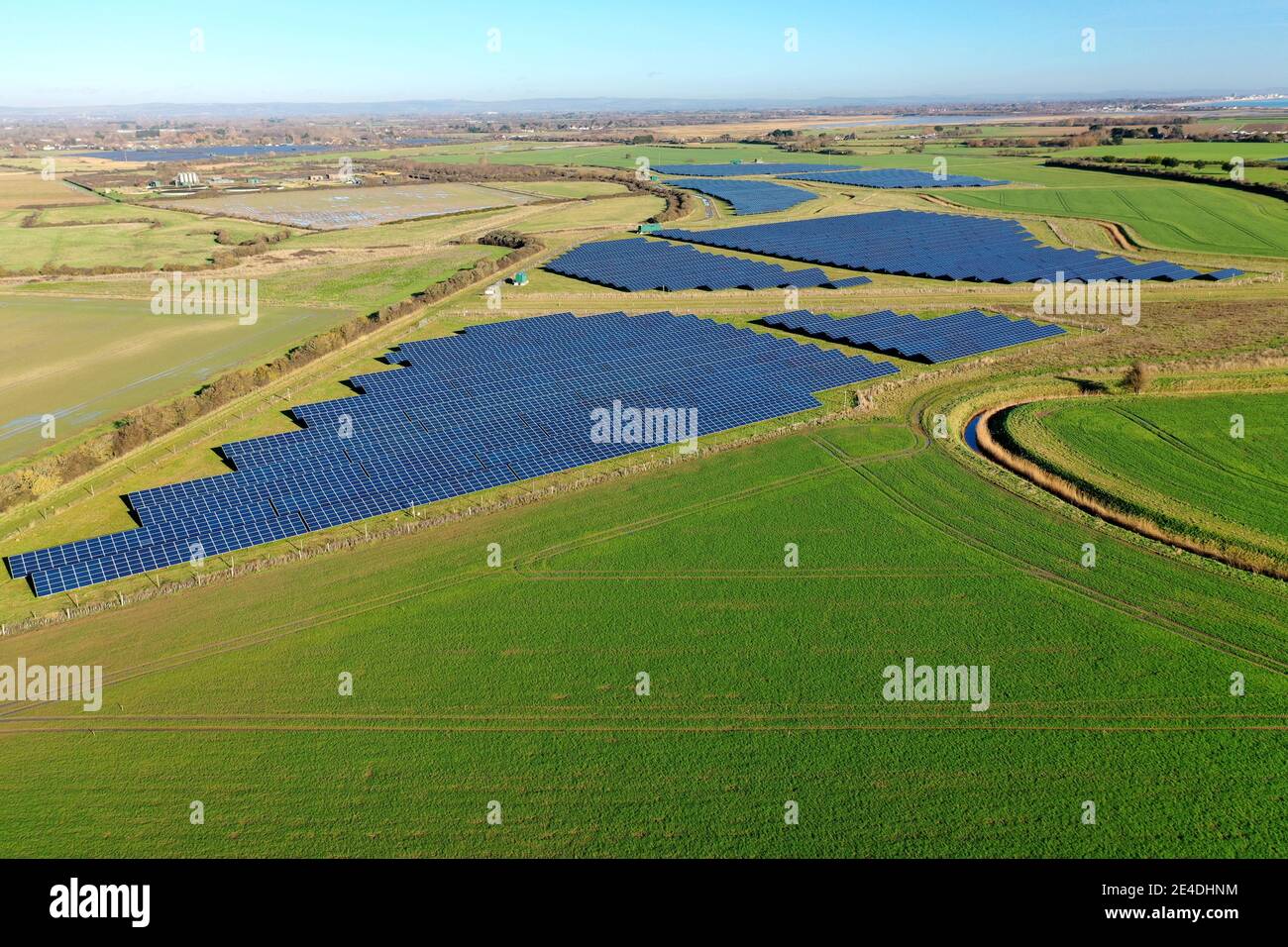 Aerial view of a solar panel farm in the beautiful countryside of ...