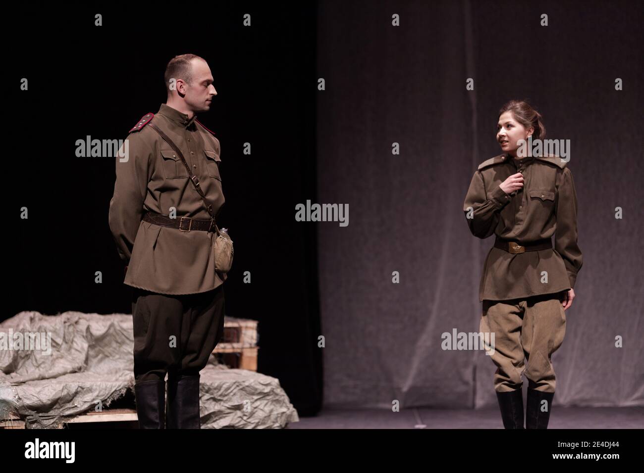 Actors in military uniforms of the Soviet army of World War II play a ...