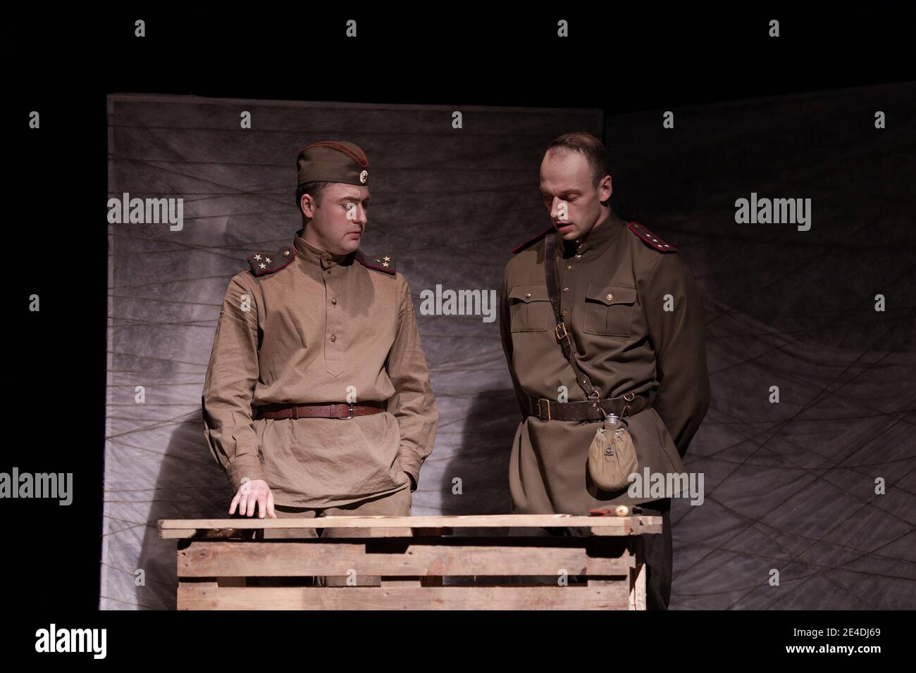 Actors in military uniforms of the Soviet army of World War II play a ...