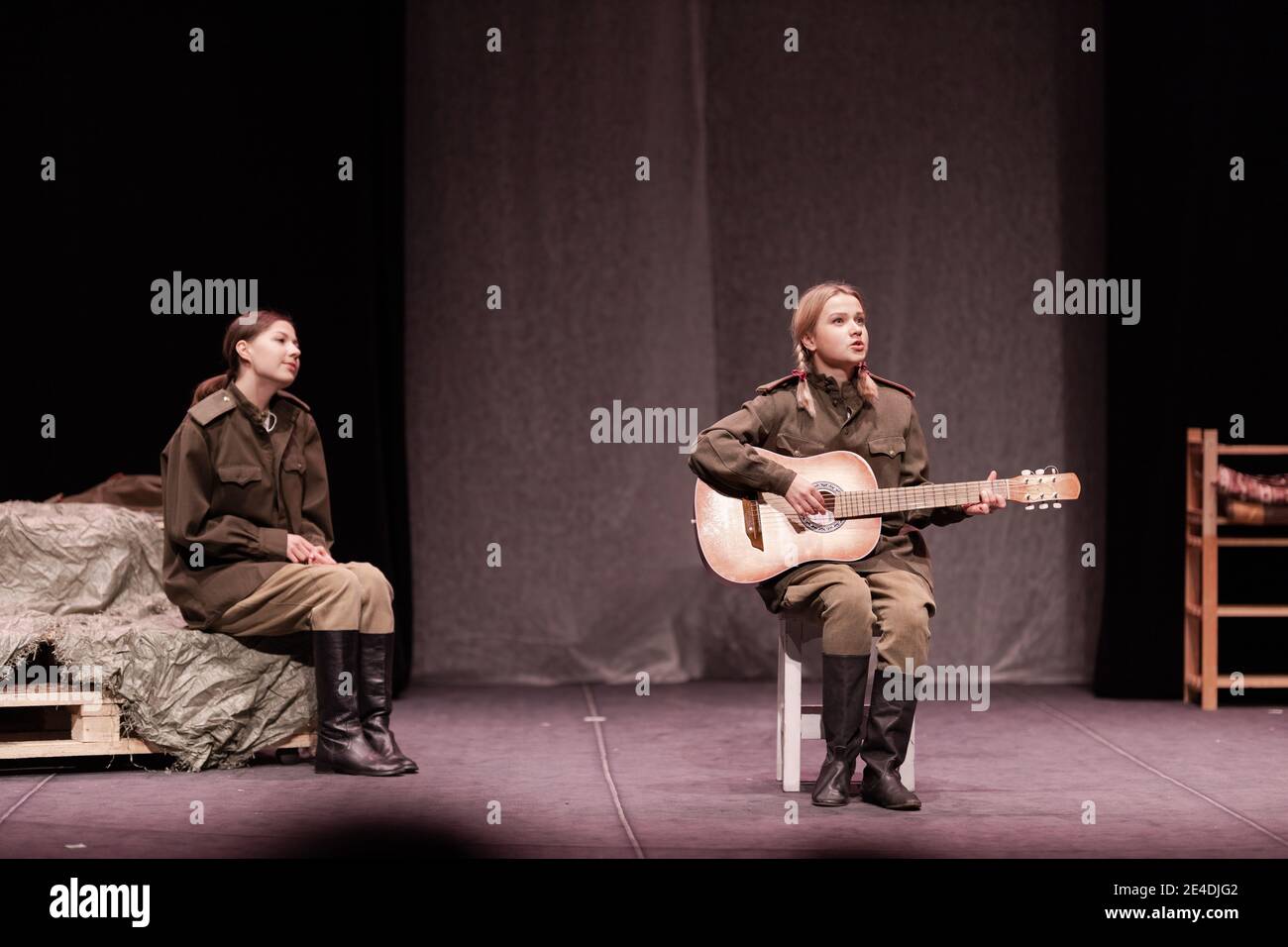 Actors in military uniforms of the Soviet army of World War II play a ...