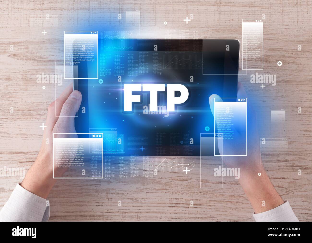 Close-up of a hand holding tablet with FTP abbreviation, modern ...