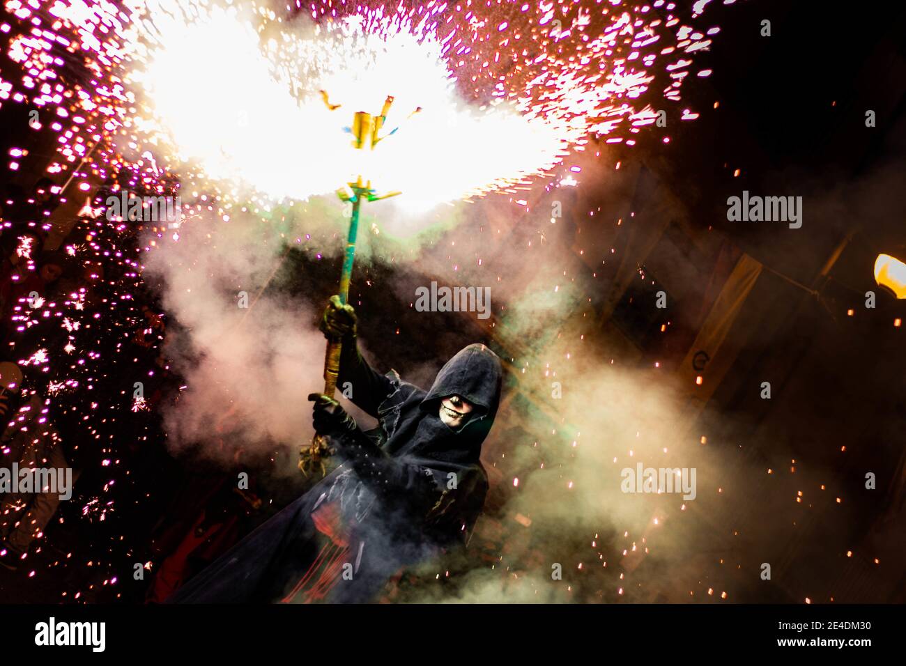 Young man lighting up a firecracker in his hand outdoors Stock Photo ...