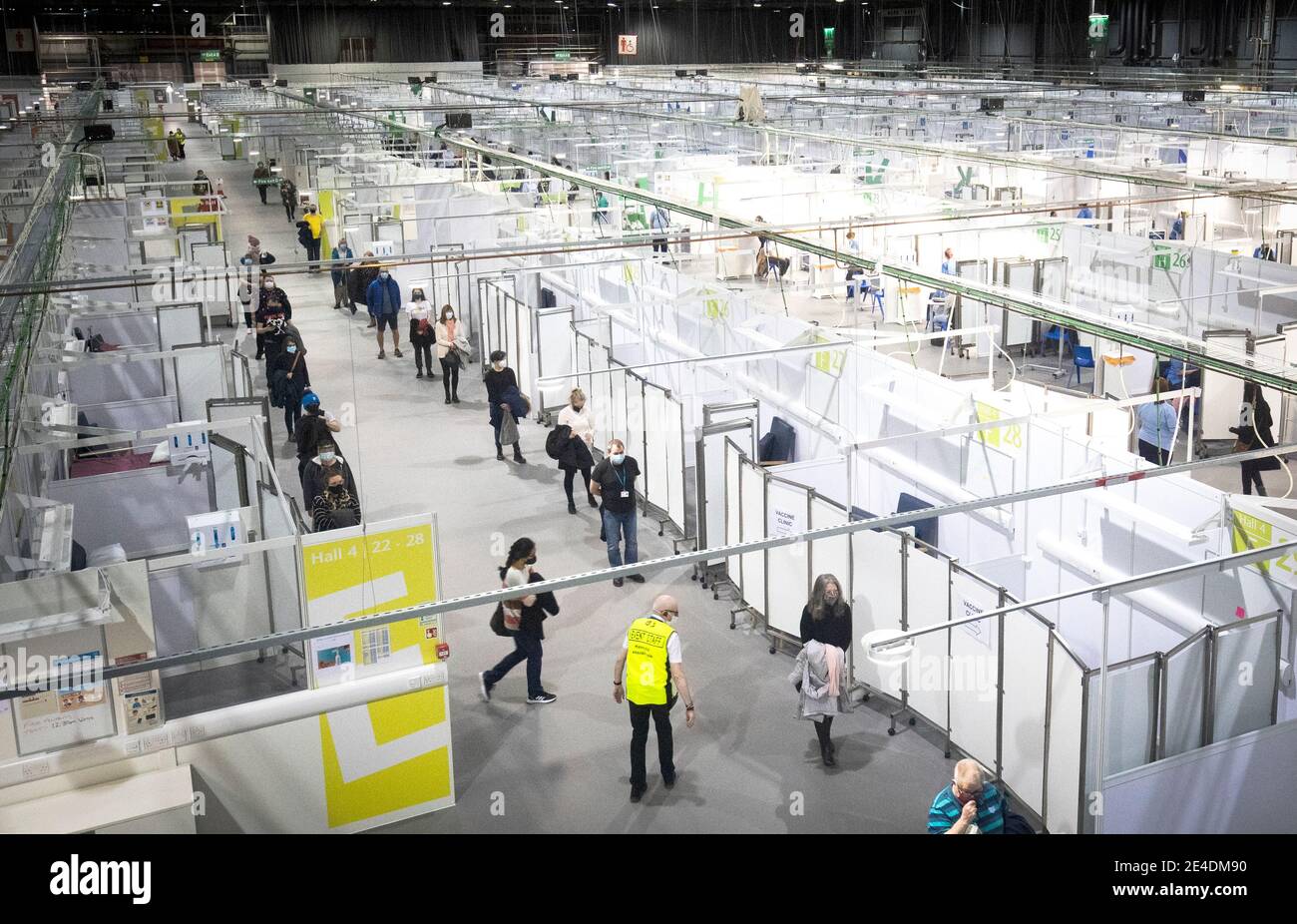 Health and social care staff queue for a coronavirus vaccine at the NHS ...