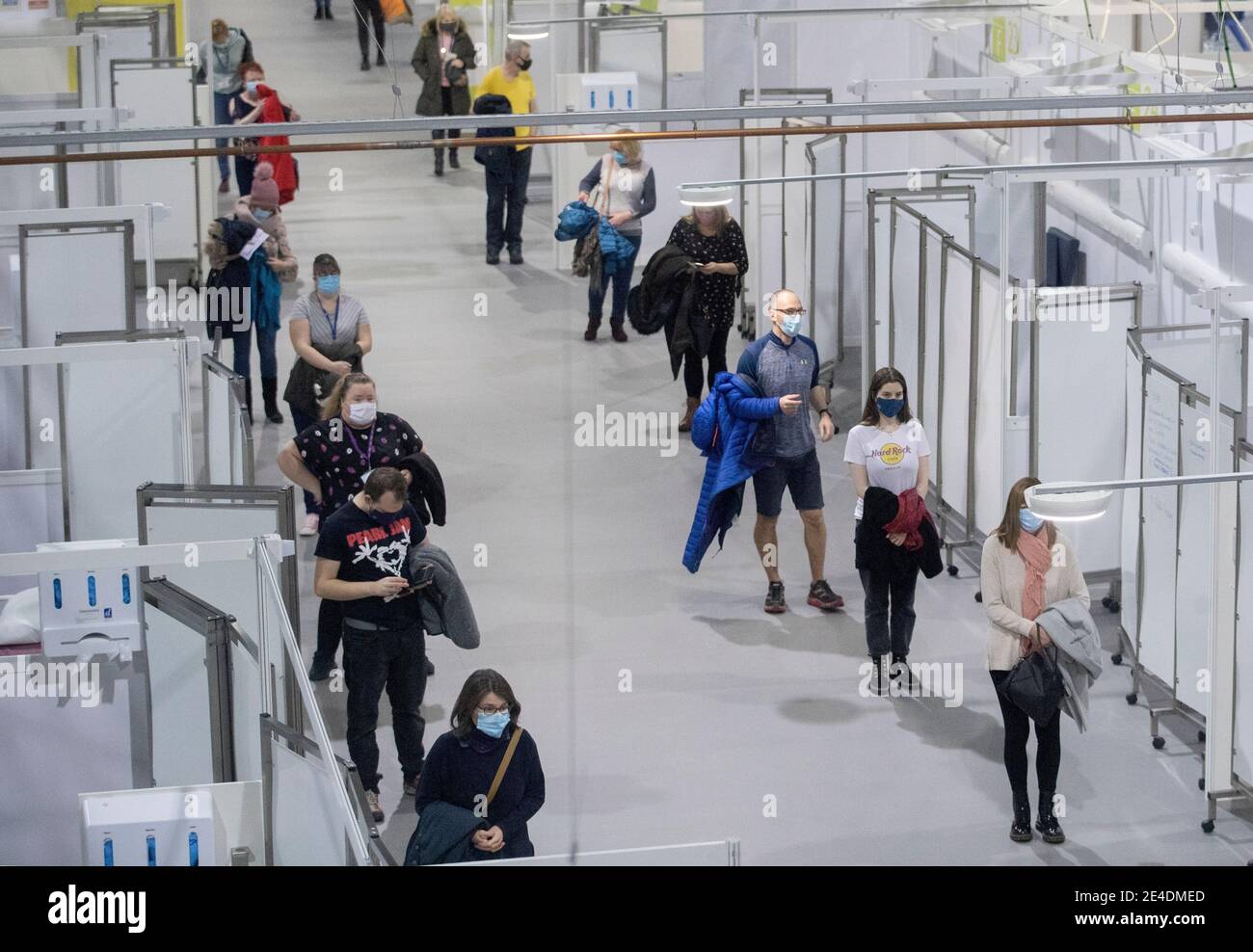 Health and social care staff queue to be vaccinated at the NHS Louisa ...