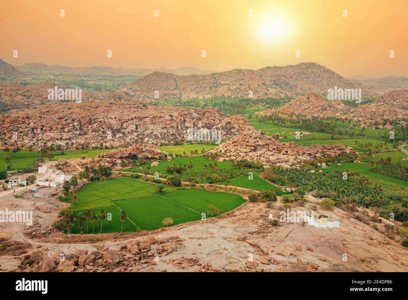 Beautiful mountain rock landscape of rice field and hills around Hampi ...