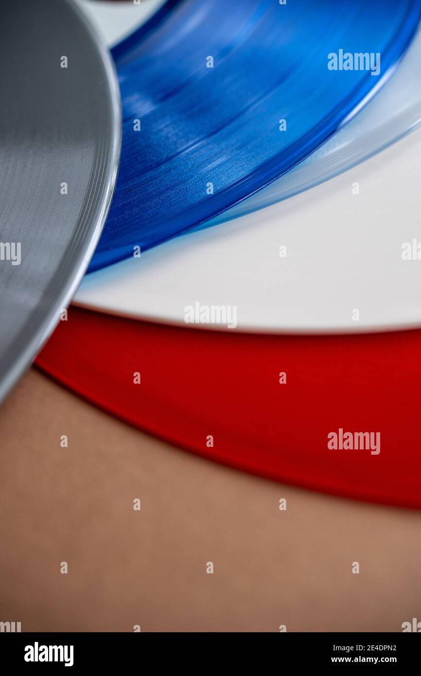 A collection of different coloured vinyl records Stock Photo - Alamy