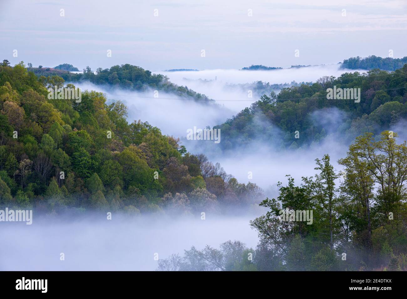Mist hangs in a valley at sunset in this image from Central Appalachia ...