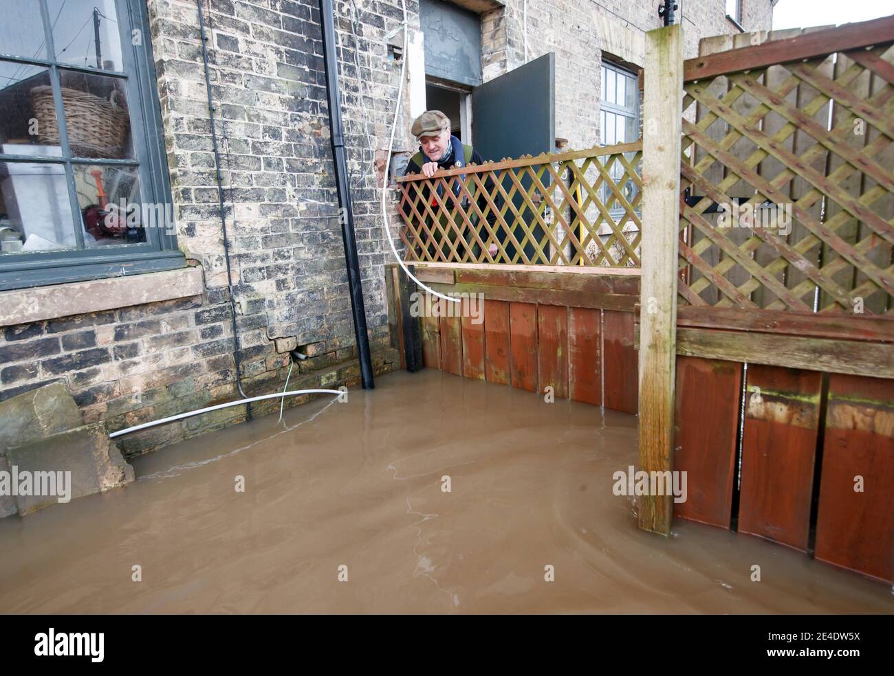 Martin Munday looks at flood water near Naburn Lock in York, following ...