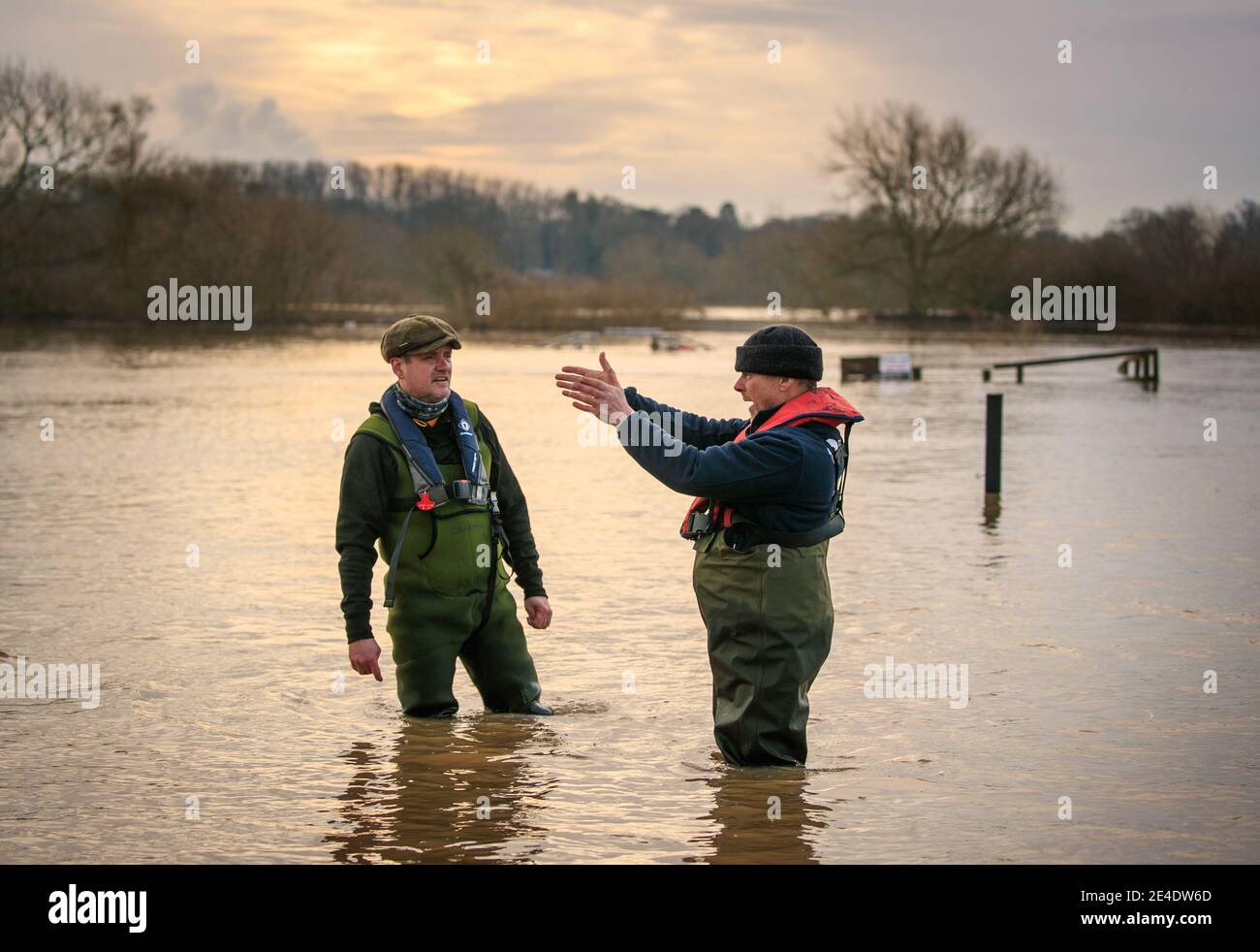 Martin Munday (left) chats to Ken Murray (right) in flood water near ...