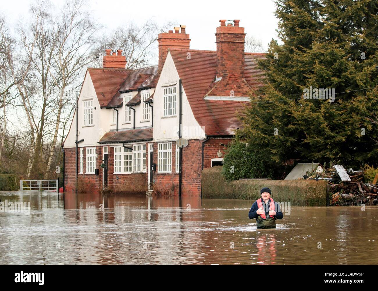 Ken Murray, Duty Lock Keeper at Naburn Lock, walks through flood water ...