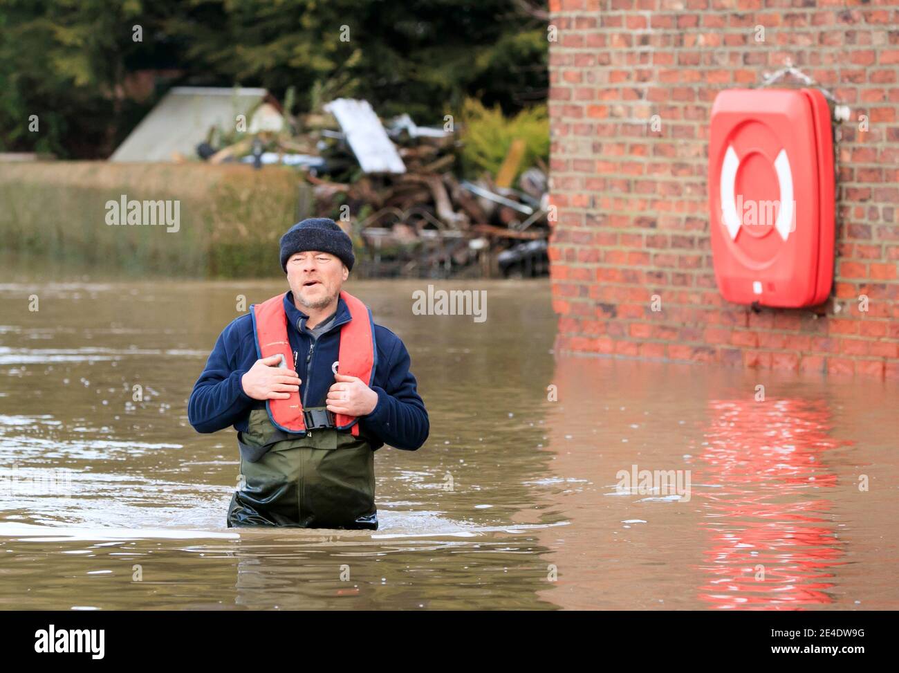 Ken Murray, Duty Lock Keeper at Naburn Lock, walks through flood water ...