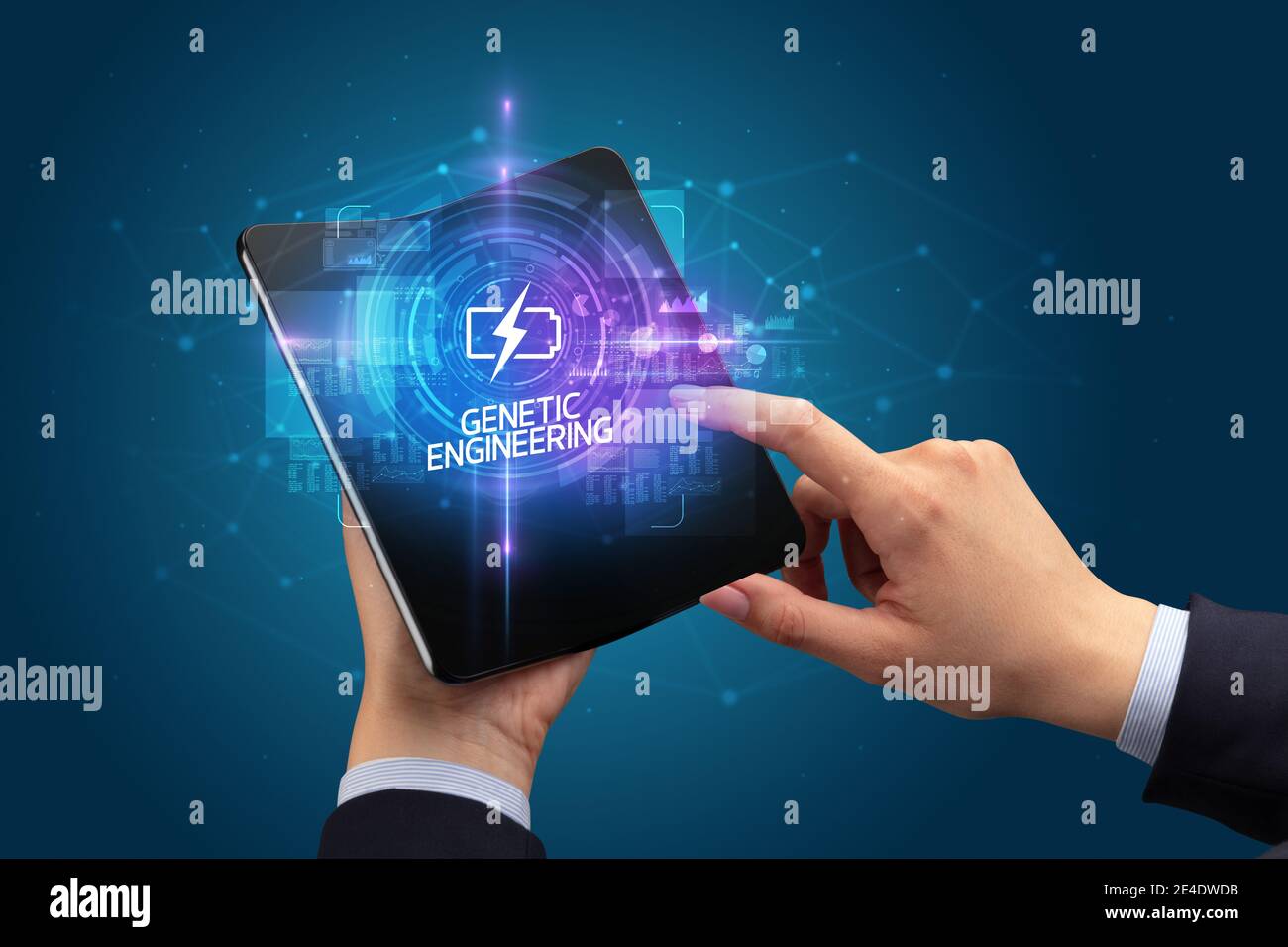 Businessman holding a foldable smartphone with AUTOMATION inscription ...