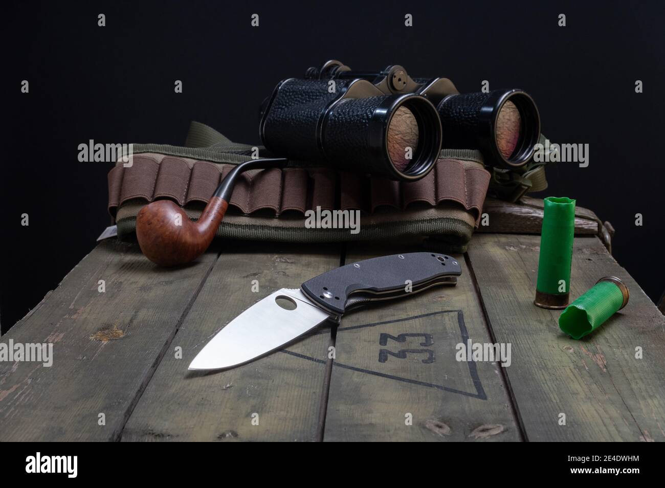Game hunter set. Smoking pipe, knife and binoculars. Hunting cartridges ...