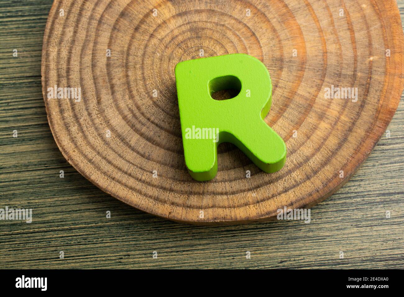 High angle shot of a plastic letter "R" on a wooden surface Stock Photo ...