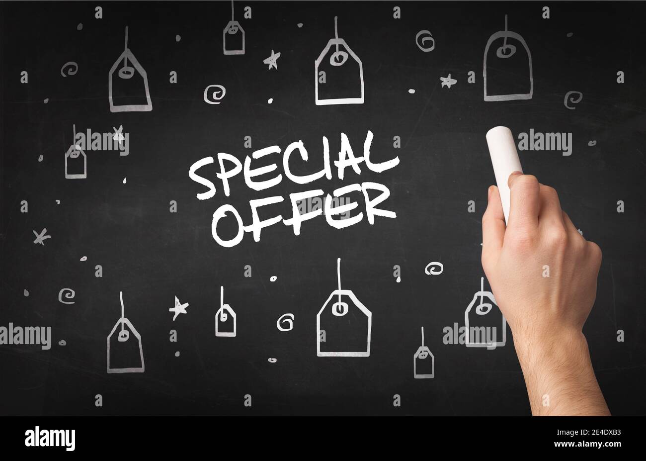 Hand drawing SPECIAL OFFER inscription with white chalk on blackboard ...