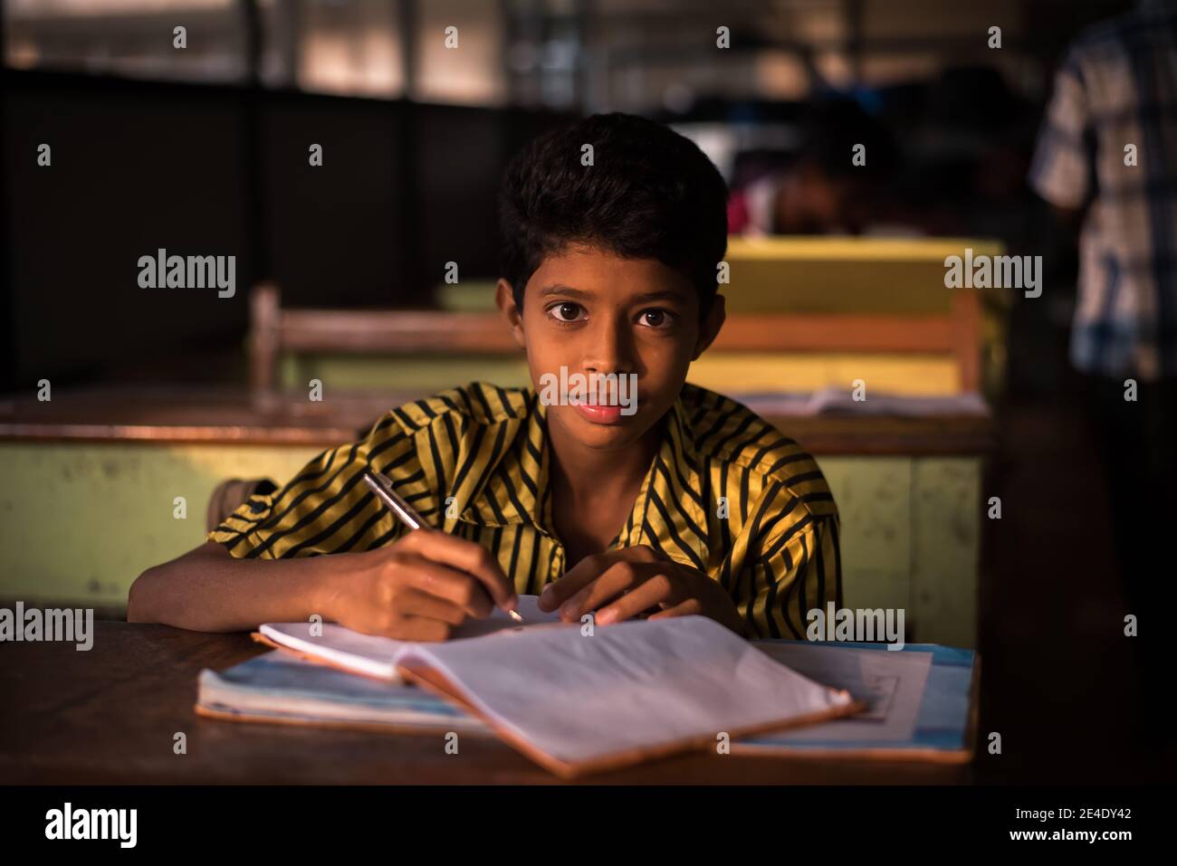 Kerala. India. 08-10-2018. Children attending a night class to finish ...