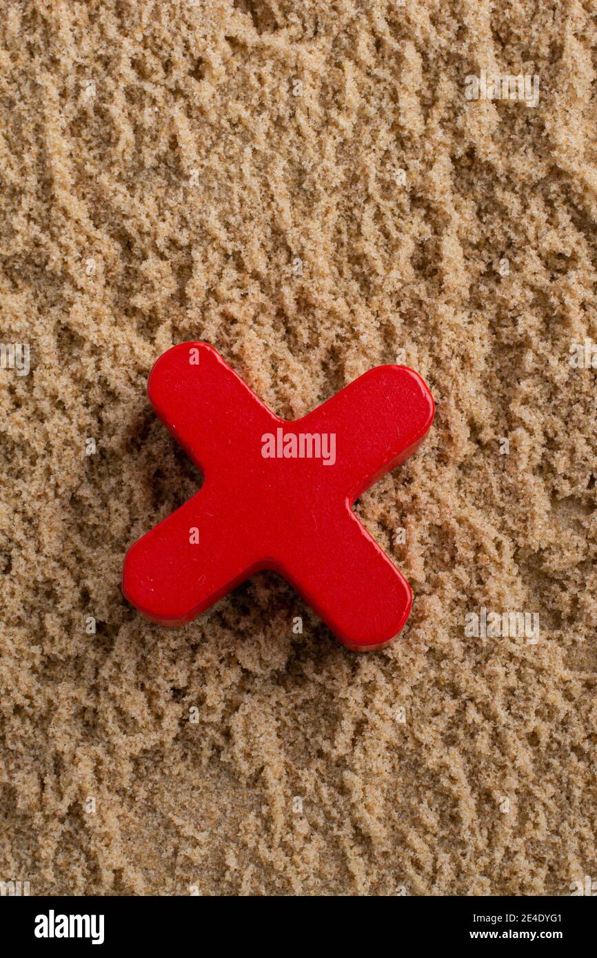 Vertical shot of a plastic letter "X" on a rough surface Stock Photo ...