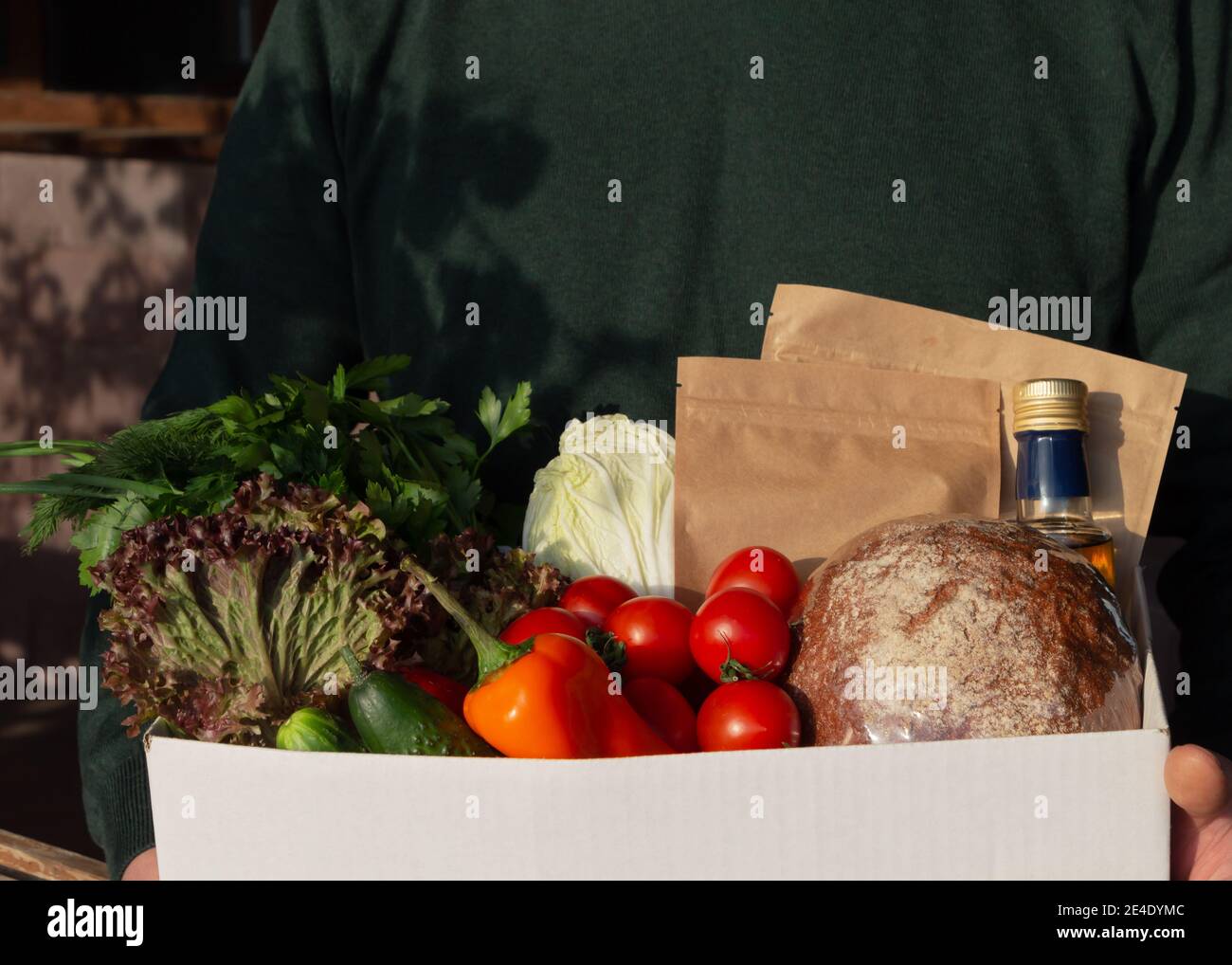 Person delivering vegetable box hi-res stock photography and images - Alamy
