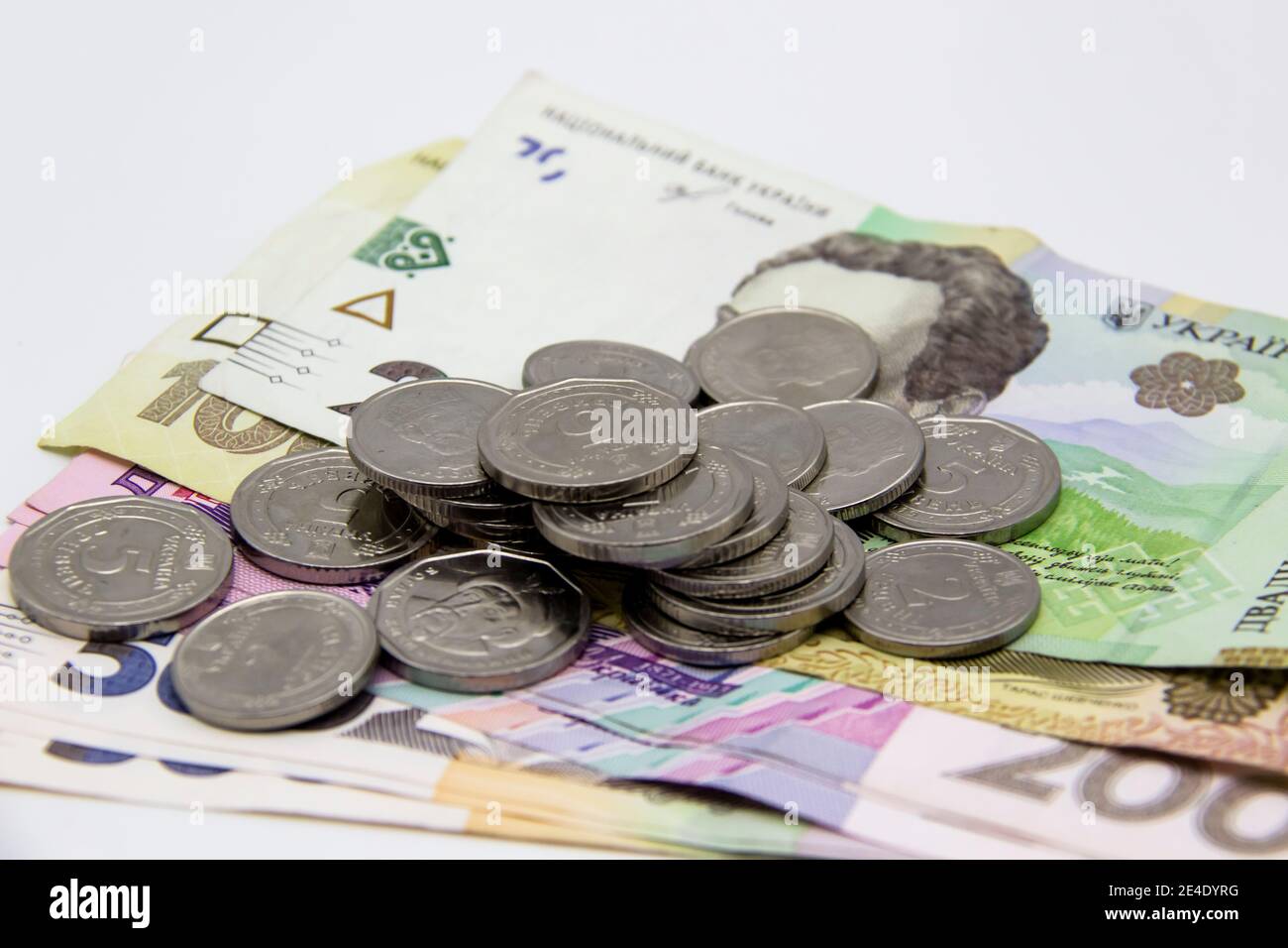 Ukrainian money on a light background. Banknotes and metal coins all ...