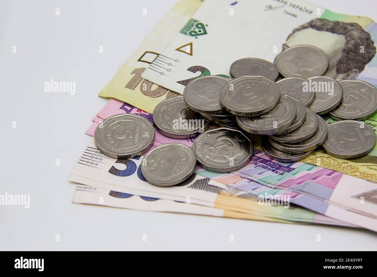 Ukrainian money on a light background. Banknotes and metal coins all ...