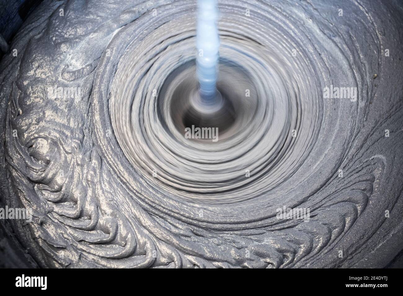The process of mixing mortar with a perforator with a special nozzle ...