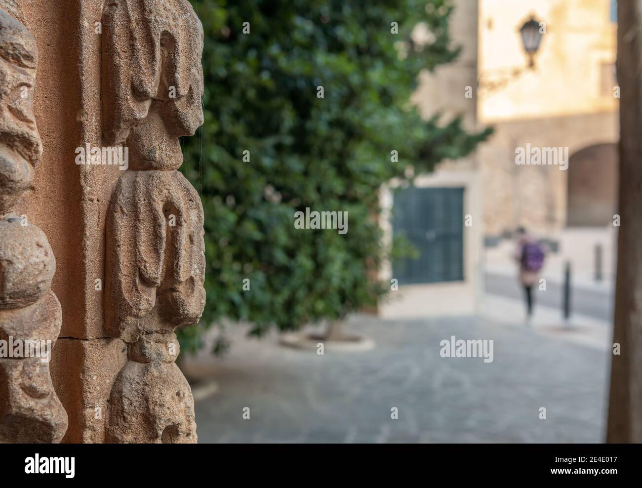 Close-up of a stone molding with an out-of-focus background of a rural ...