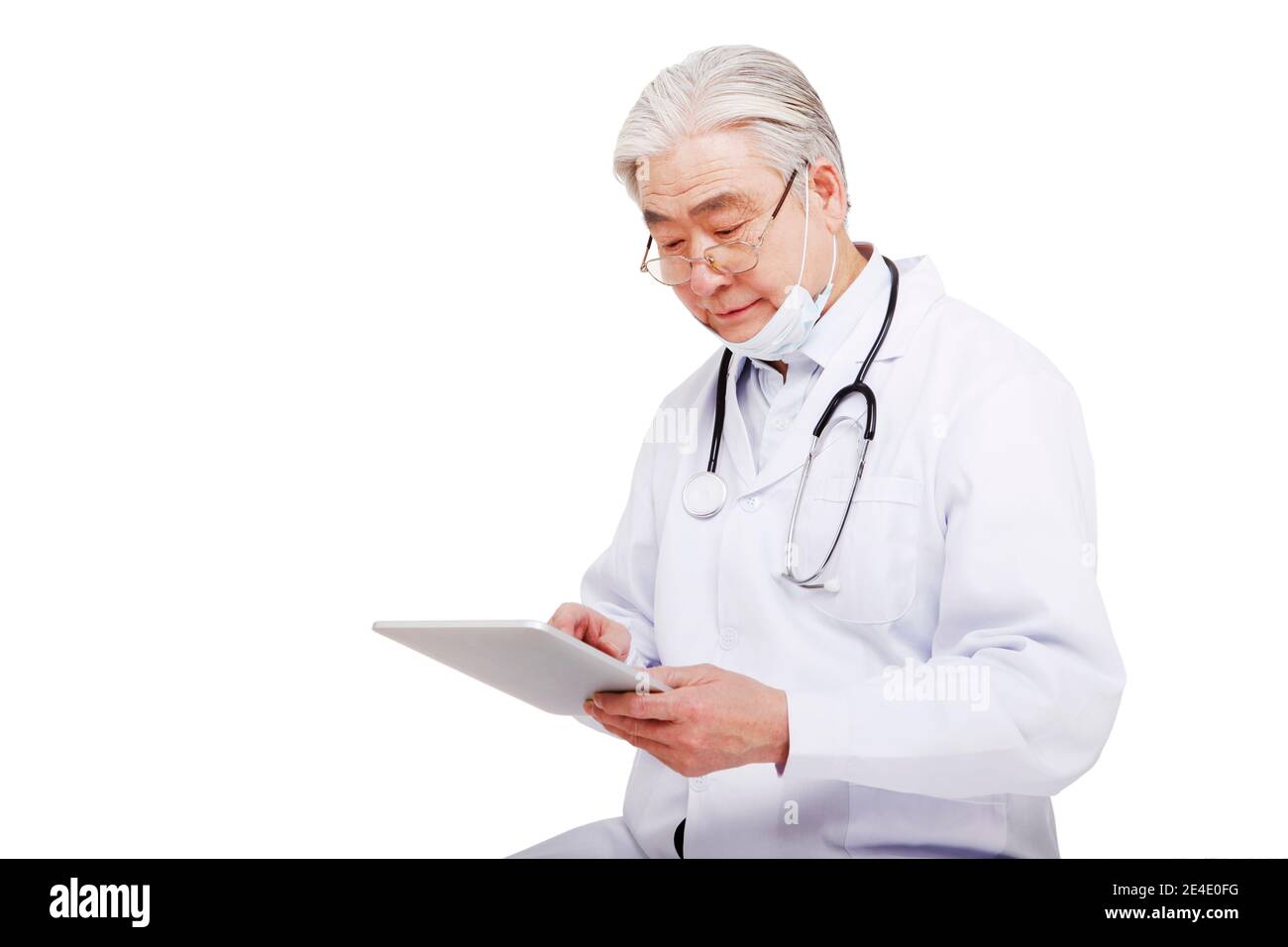 Adult doctor uses digital tablet hi-res stock photography and images ...