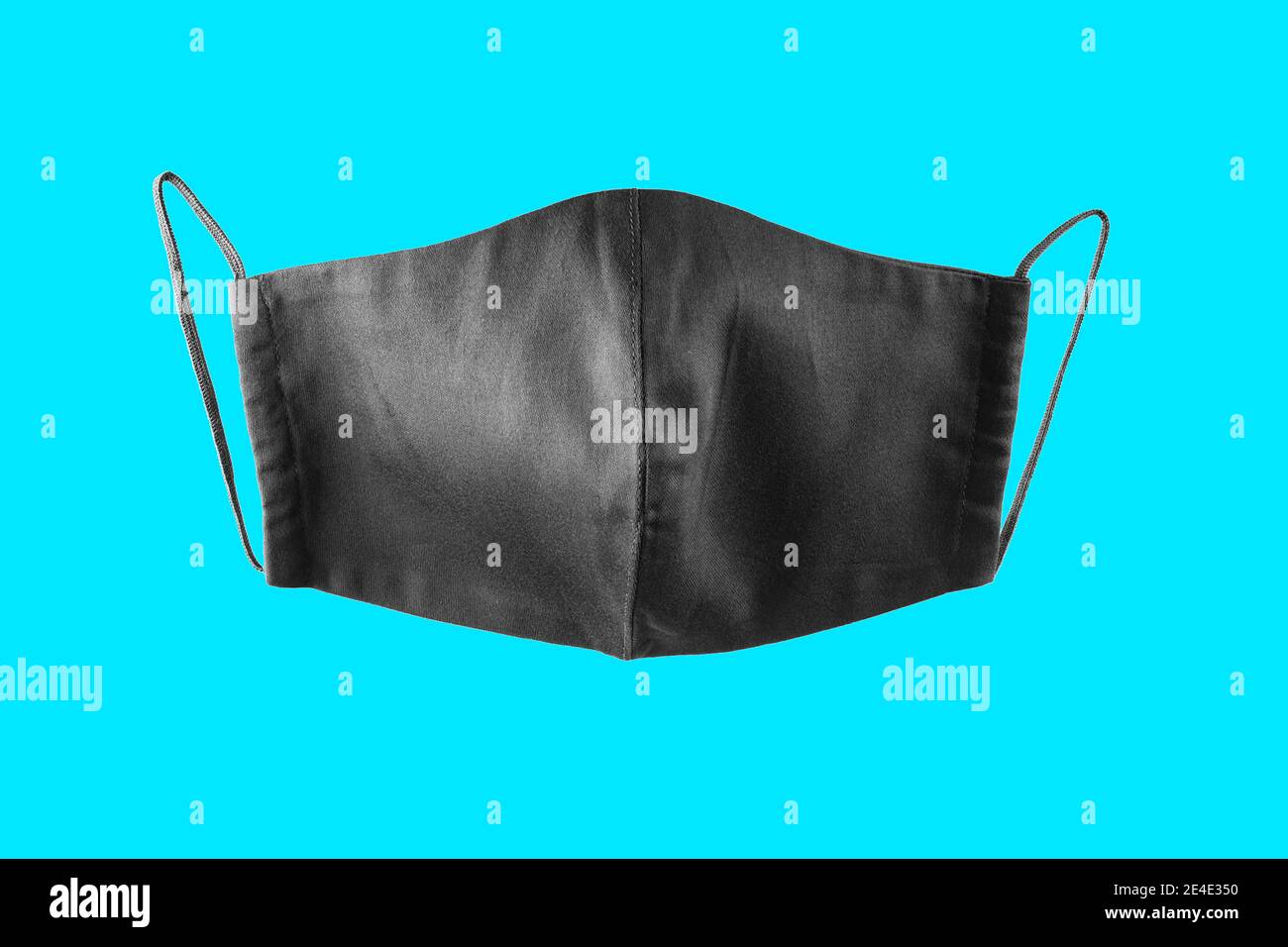 Black face protective mask on a light blue background. Reusable face ...