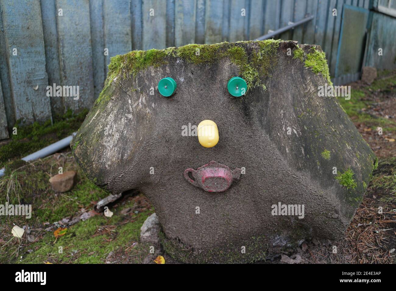 tree stump forest spirit with funny face, decorated with trinkets Stock ...