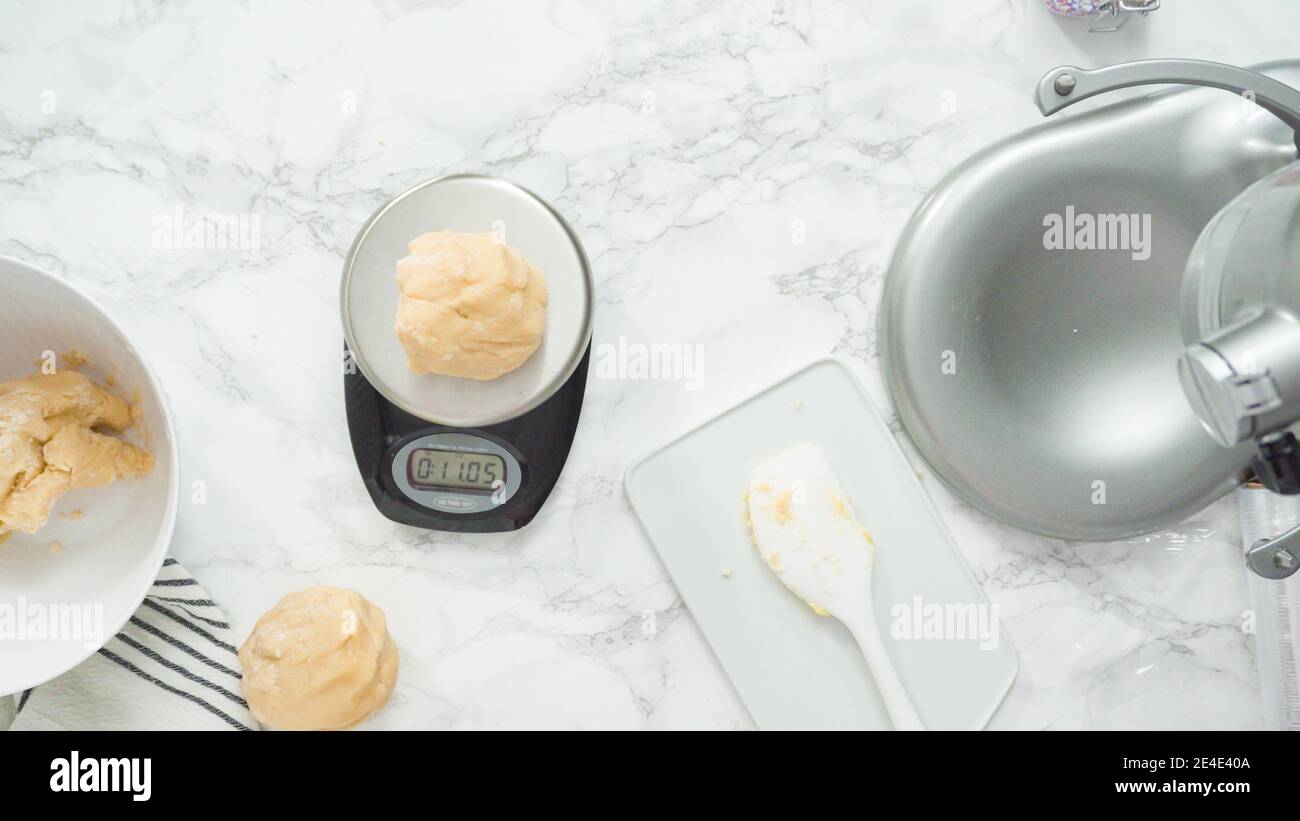 Step by step. Flat lay. Measuring cookie dought with a digital kitchen ...