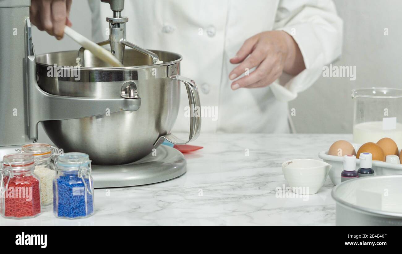 Step by step. Mixing ingredients in standing kitchen mixer to bake a ...