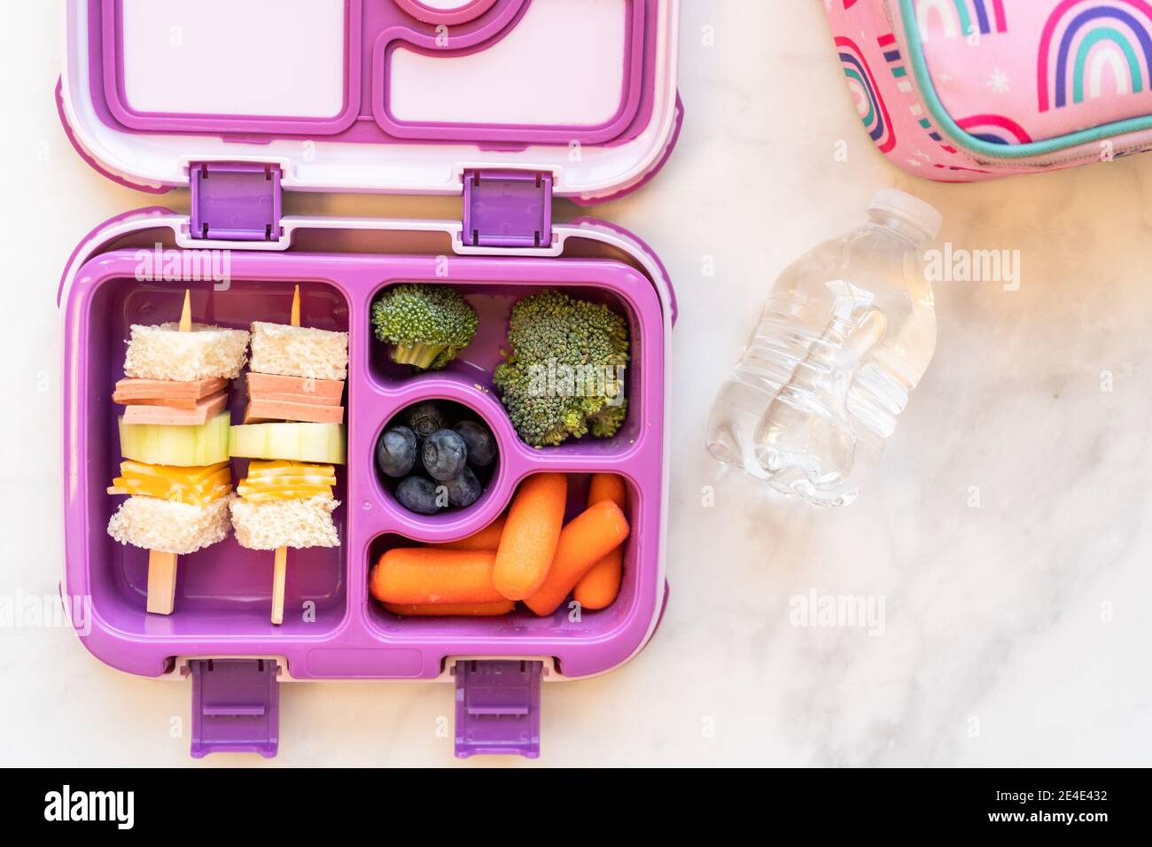 Flat lay. Healthy school lunch with kebab sandwich and vegetables in ...