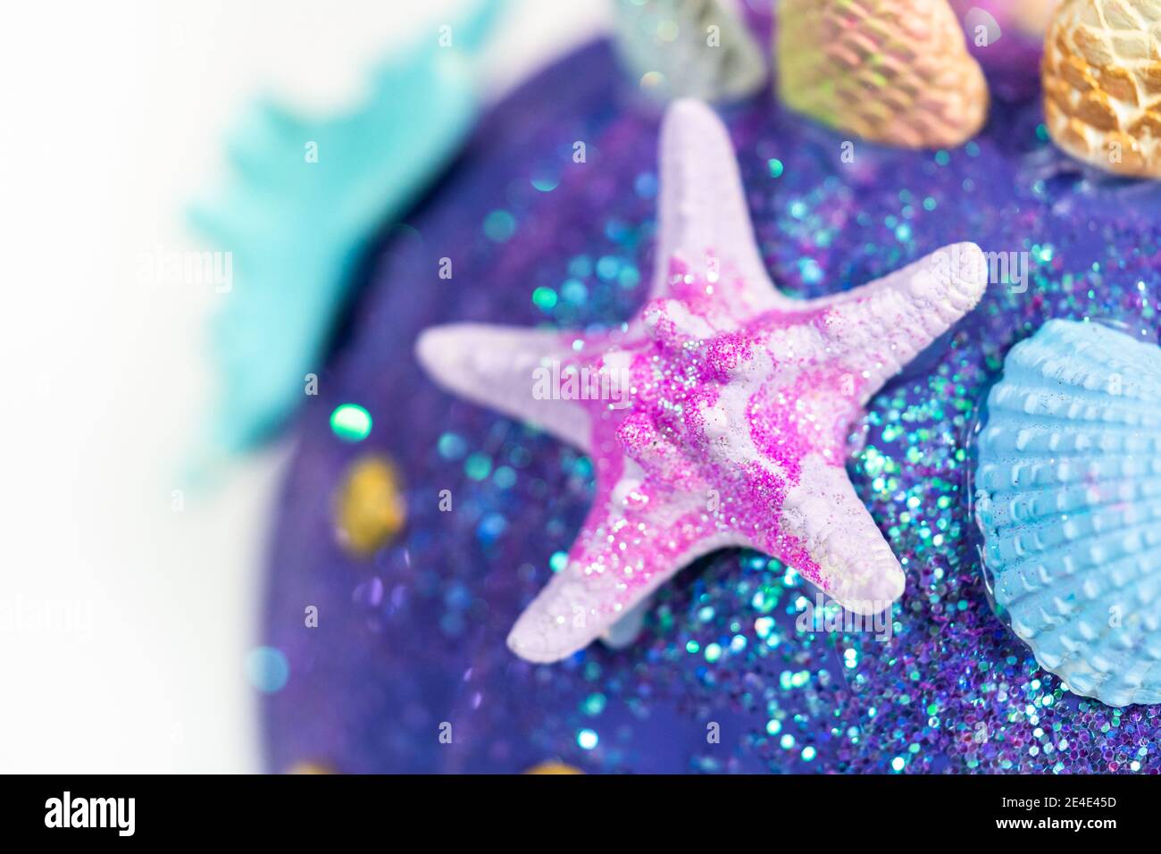 Halloween craft pumpkins decorated with mermaid tails, glitter, and ...